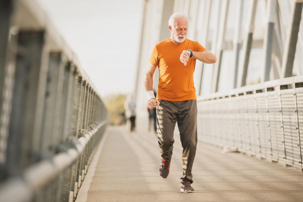 Free Stock Photo of Senior man running on a bridge during sunset ...