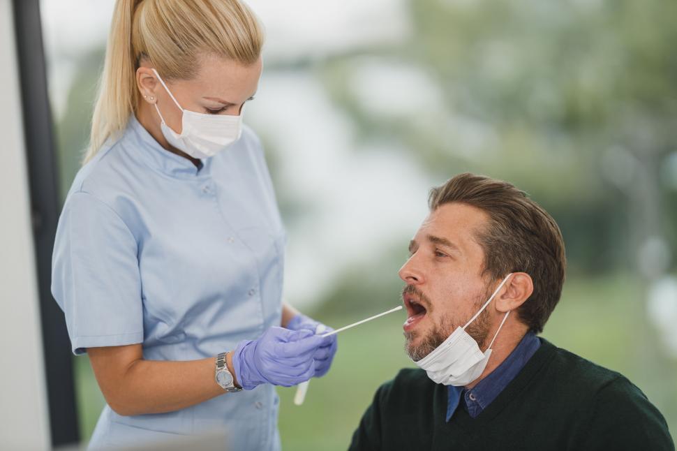 Free Stock Photo of Nurse performing COVID-19 test on patient ...