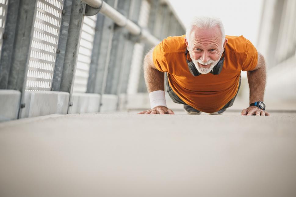 Free Stock Photo of Elderly man doing pushups on a sunny bridge ...