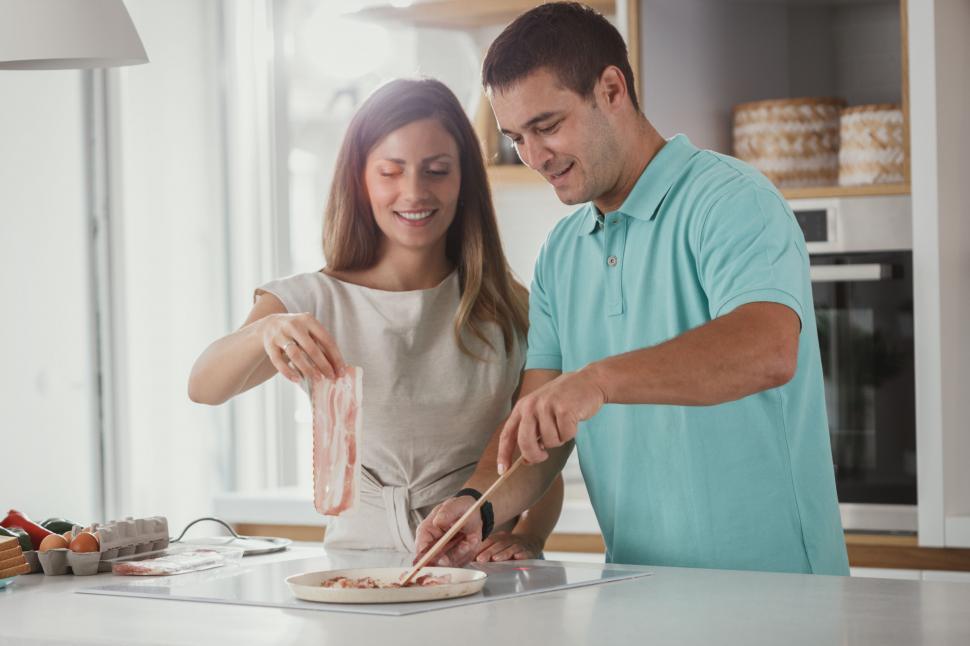 Free Stock Photo of Couple cooking bacon in a kitchen | Download Free ...