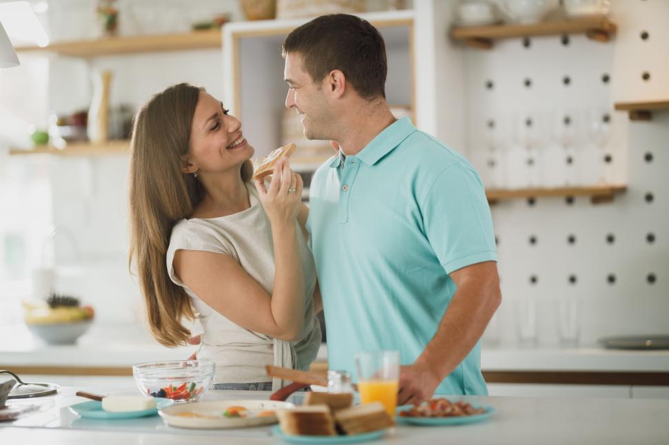 Free Stock Photo of Couple tasting food in a cozy kitchen | Download ...