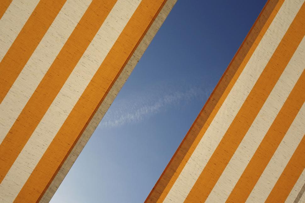 Free Stock Photo of Vibrant orange striped building under blue sky ...