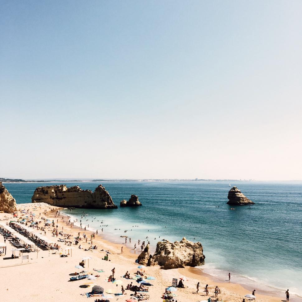 Free Stock Photo of Busy beach with iconic rock formations | Download ...
