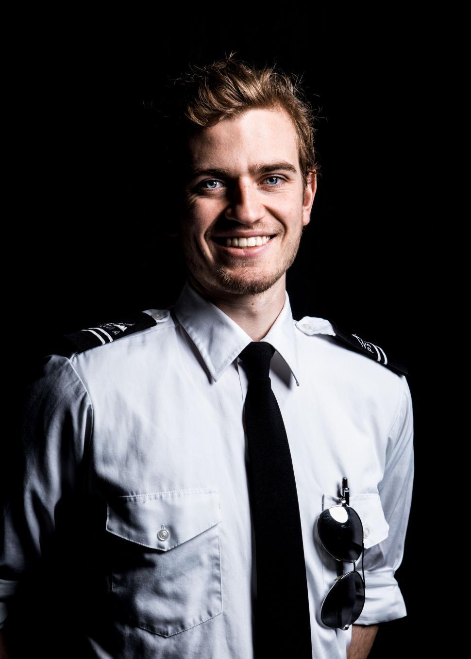 Free Stock Photo of Smiling pilot portrait against black background ...