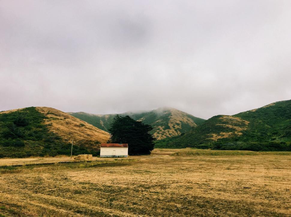 Free Stock Photo of Lone house in expansive green valley hills ...