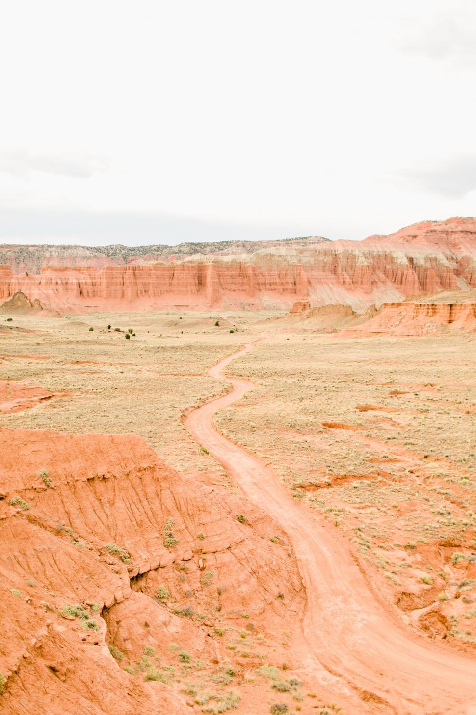 Free Stock Photo of Red desert landscape with winding dirt road ...