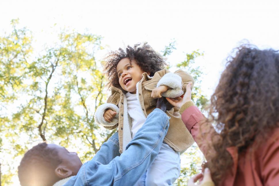 Free Stock Photo of Child lifted in the air by parents | Download Free ...