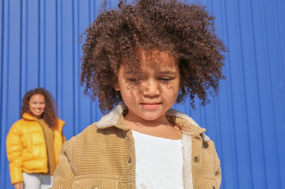 Free Stock Photo of Sad child with family in background | Download Free ...