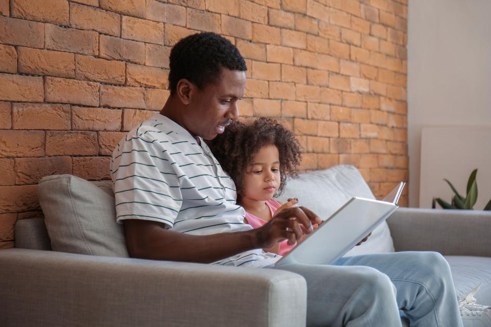 Free Stock Photo of Father and child engaging with laptop at home ...
