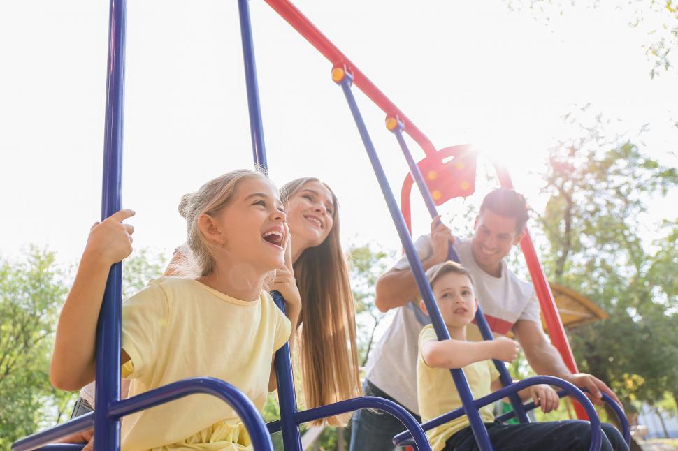 Free Stock Photo of Family fun on playground swing set in sun ...