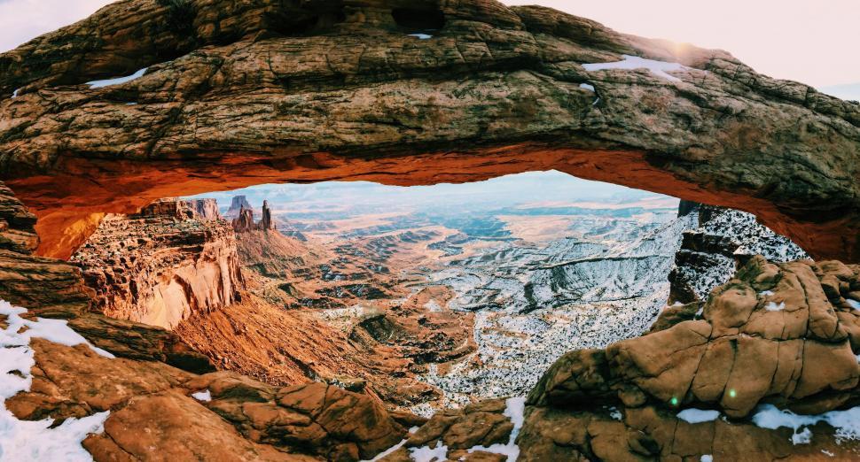 Free Stock Photo of Snowy arch overlooking a rugged canyon view ...
