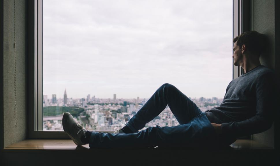 Free Stock Photo of Man gazing over cityscape from window | Download ...