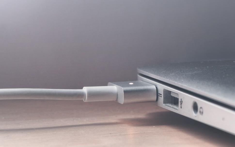 Free Stock Photo of Laptop charger connected to laptop on desk ...