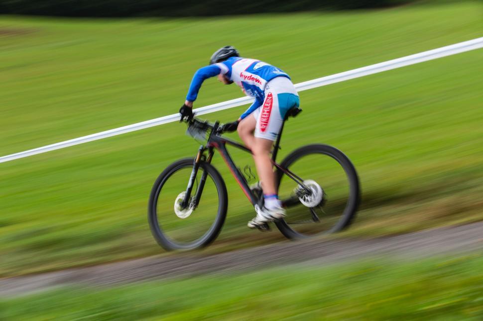 Free Stock Photo of Cyclist in motion blur racing on track | Download ...