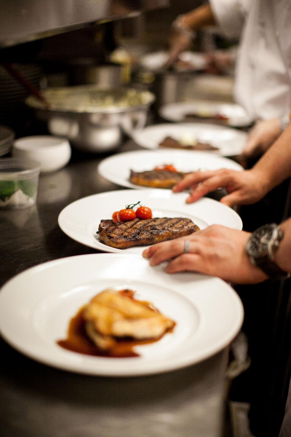 Free Stock Photo of Chefs plating gourmet dishes in kitchen | Download ...
