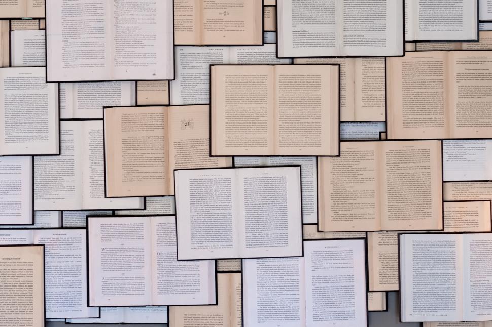Free Stock Photo of Wall filled with open books on display | Download ...