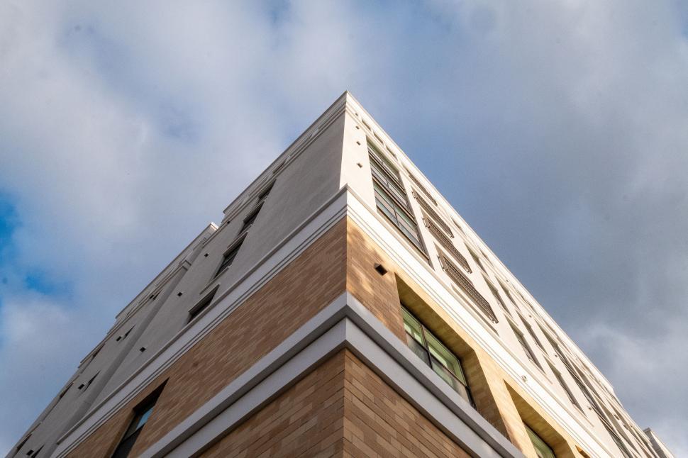 Free Stock Photo of Looking up at modern corner building against sky ...