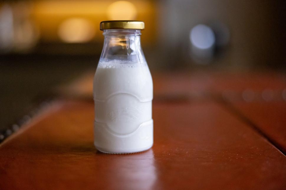 Free Stock Photo of Single small milk bottle on wooden table | Download ...