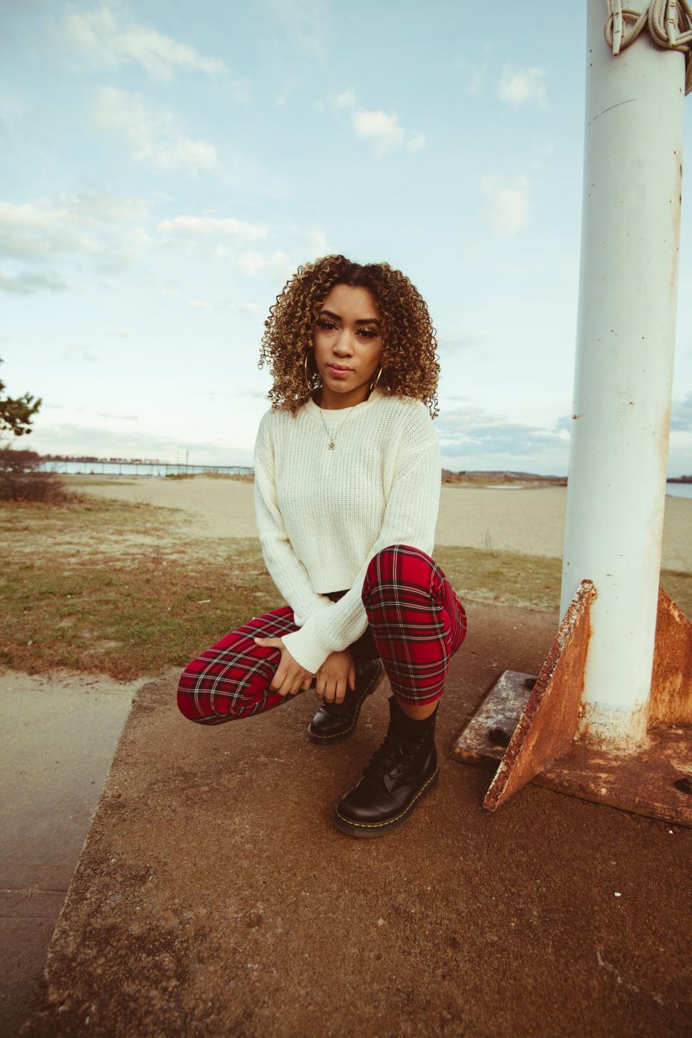 Free Stock Photo of Casual woman squatting near pillar | Download Free ...