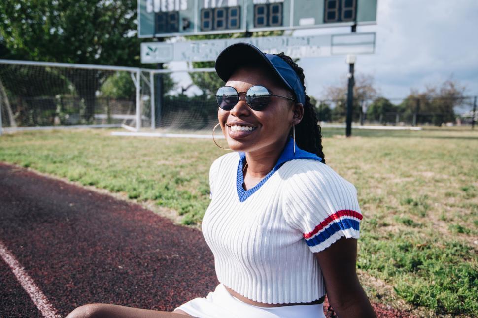 Free Stock Photo of Woman sitting by athletic track on sunny day ...
