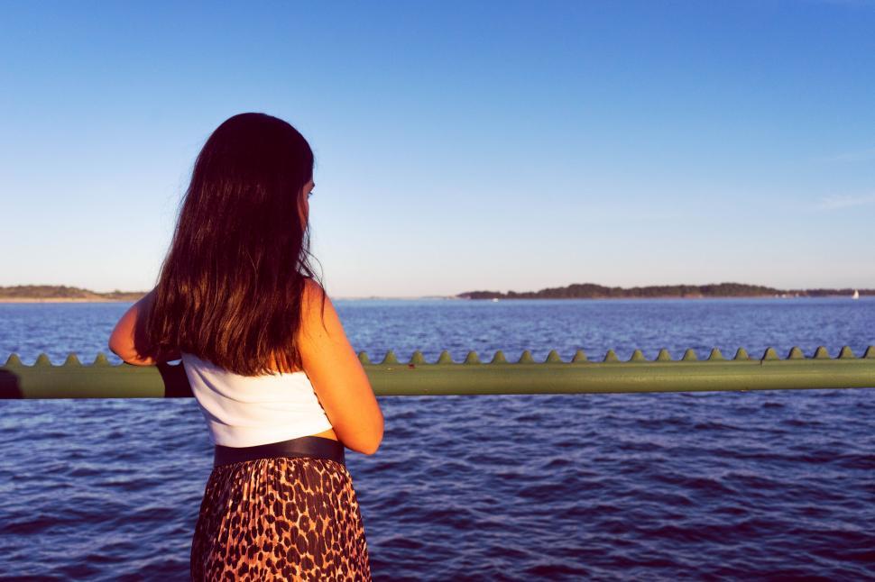 Free Stock Photo of Woman looking at water from bridge railing ...