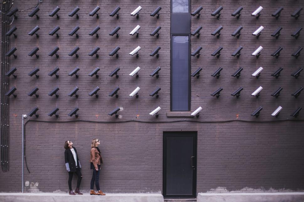 Free Stock Photo of Two people under surveillance camera wall ...
