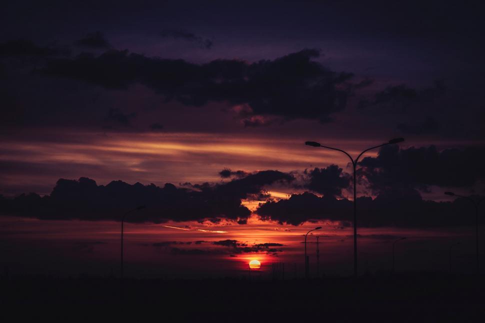 Free Stock Photo of Dramatic Sunset with Streetlights and Clouds ...