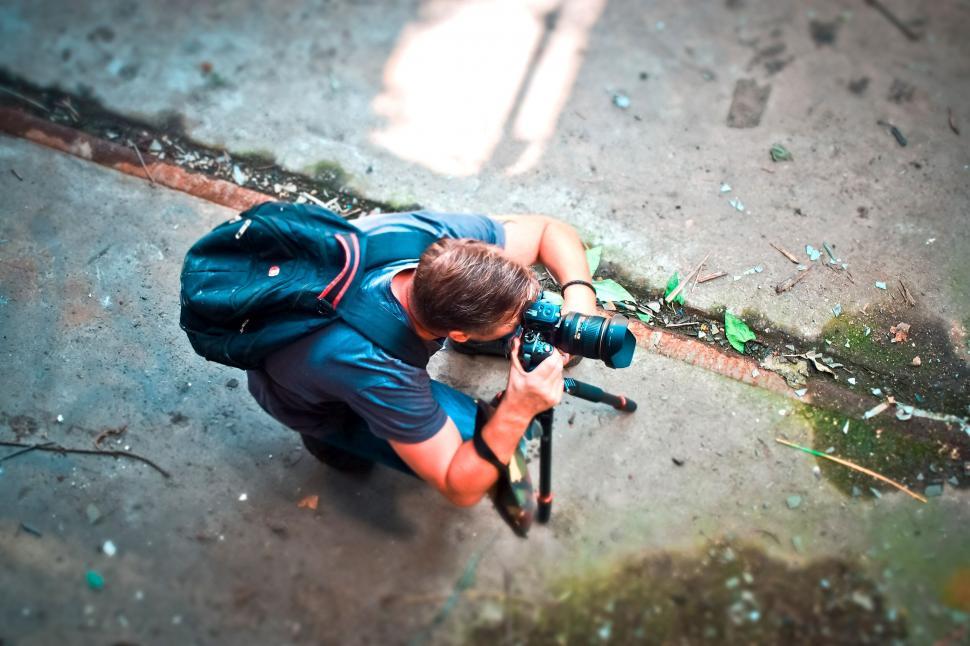 Free Stock Photo of Photographer capturing ground detail | Download ...