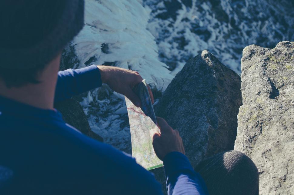 Free Stock Photo of Hiker reading a map on mountain top | Download Free ...