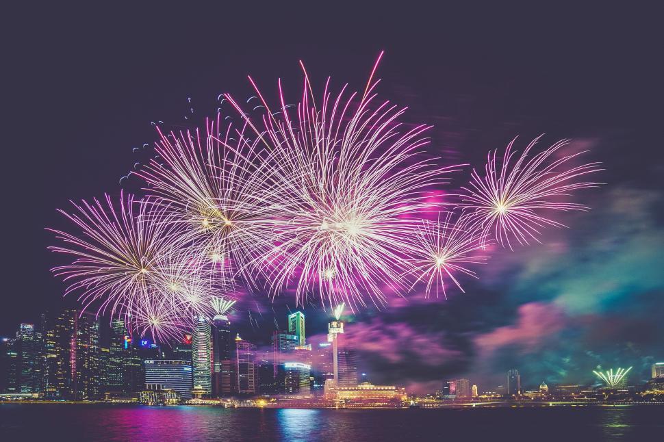 Free Stock Photo of Colorful fireworks over city skyline at night ...