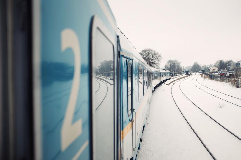 Free Stock Photo of Train curving on snowy tracks perspective ...