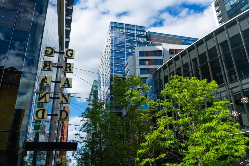 Free Stock Photo of Modern buildings behind a vintage sign | Download ...