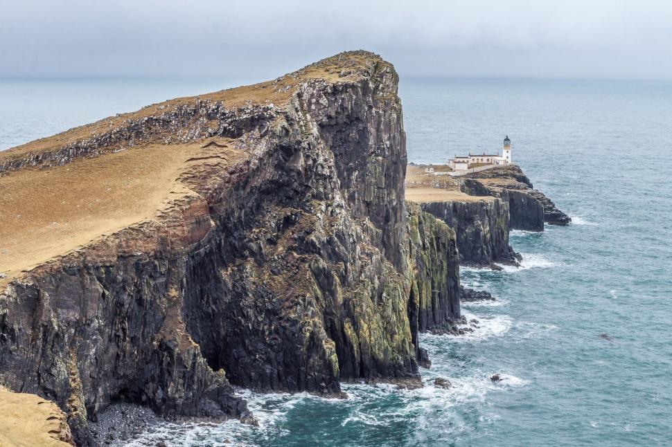 Free Stock Photo of Rustic lighthouse atop rugged coastal cliffs ...