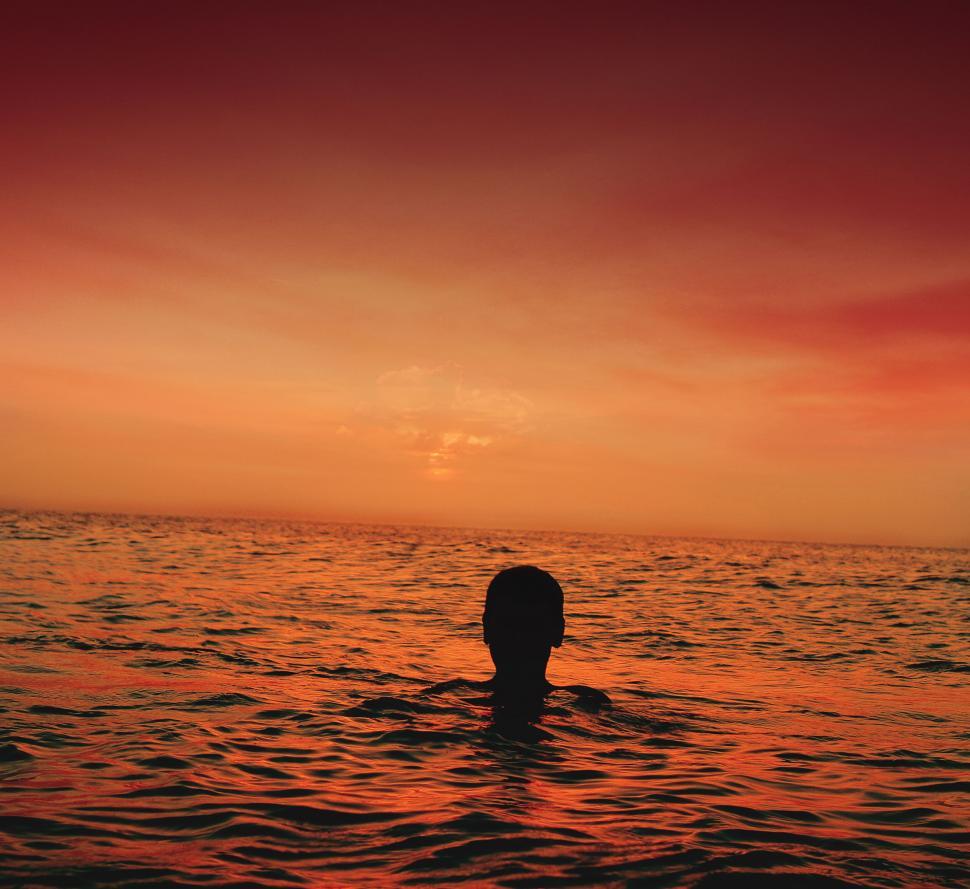 Free Stock Photo of Individual swimming in ocean during sunset ...