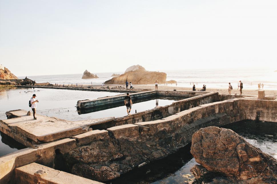 Free Stock Photo of People at a coastal tidal pool during sunset ...