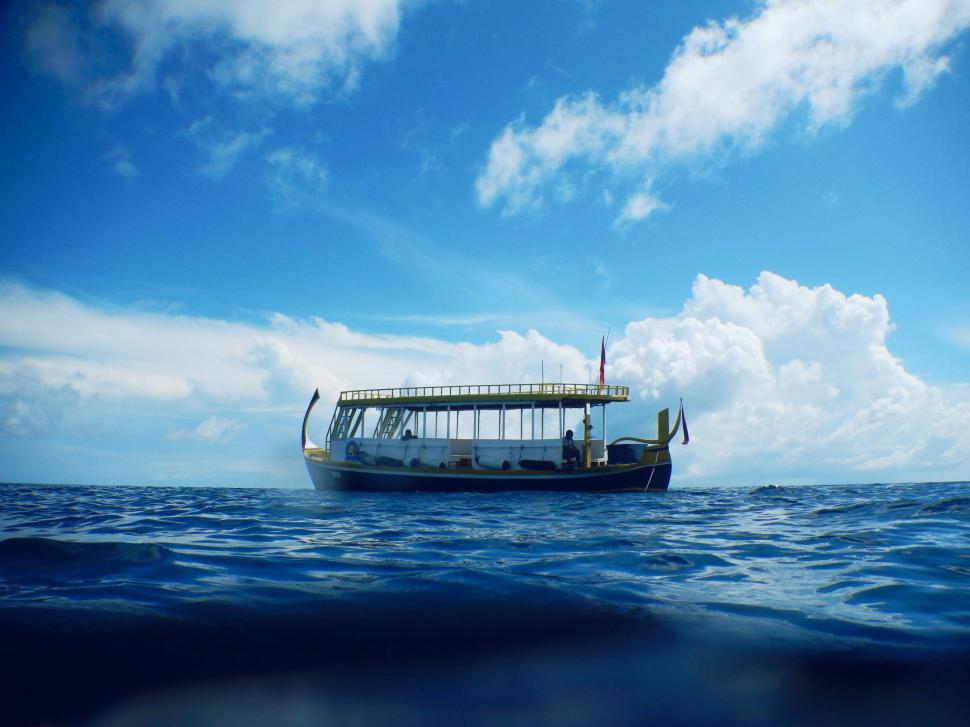 Free Stock Photo of Boat floating on a calm blue ocean | Download Free ...