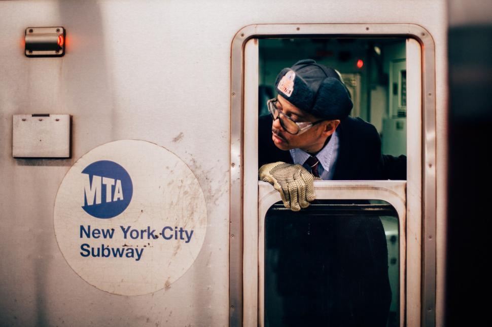 Free Stock Photo of Subway worker leaning out train door | Download ...