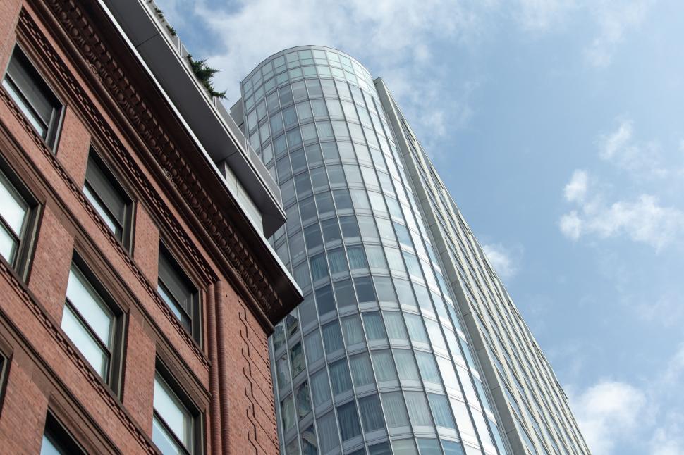 Free Stock Photo of Curved glass building juxtaposed with old brick ...