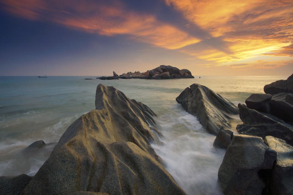 Free Stock Photo of Ethereal sunset over sculpted coastal rocks ...