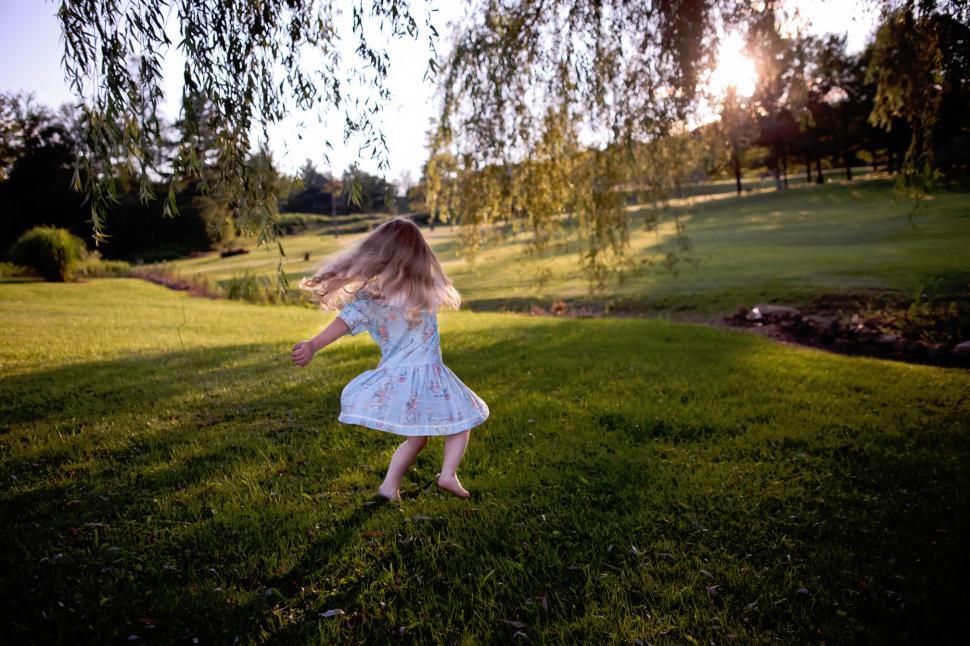 Free Stock Photo of Little girl twirling in a park at sunset | Download ...