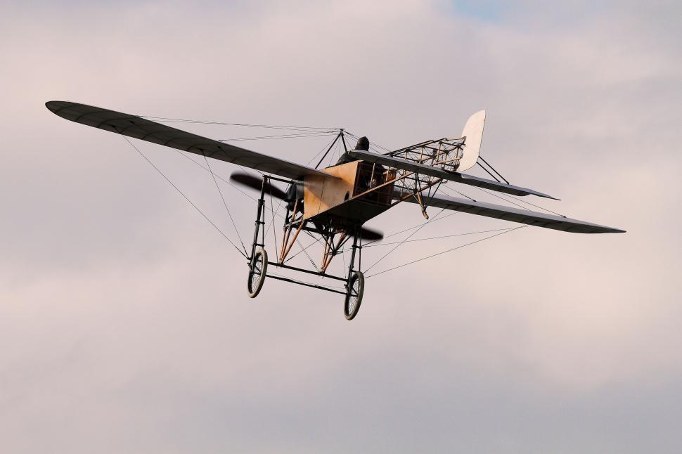 Free Stock Photo of Vintage biplane flying against cloudy sky ...