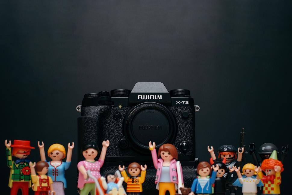 Free Stock Photo of Camera and colorful toy figures displayed ...