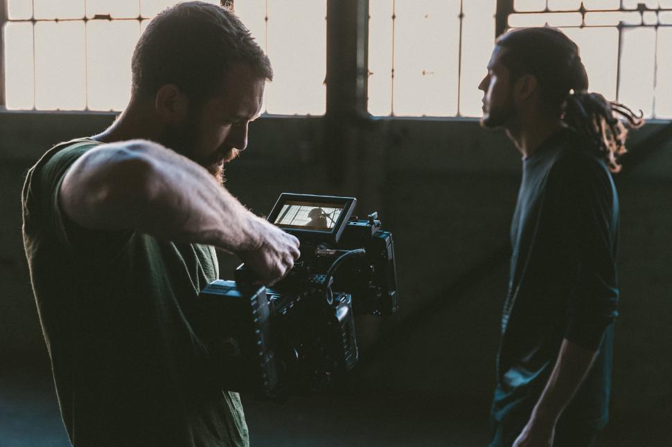 Free Stock Photo of Two people filming scene in a studio | Download ...
