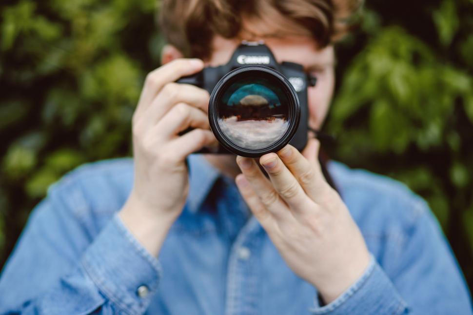 Free Stock Photo of Person holding camera covering face | Download Free ...