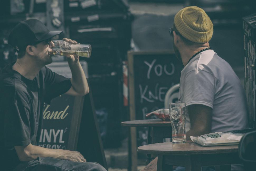 Free Stock Photo of Two men sitting at an outdoor bar table | Download ...