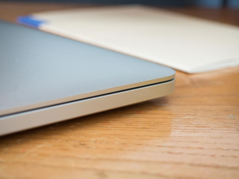 Free Stock Photo of Laptop partially closed on a wooden desk | Download ...