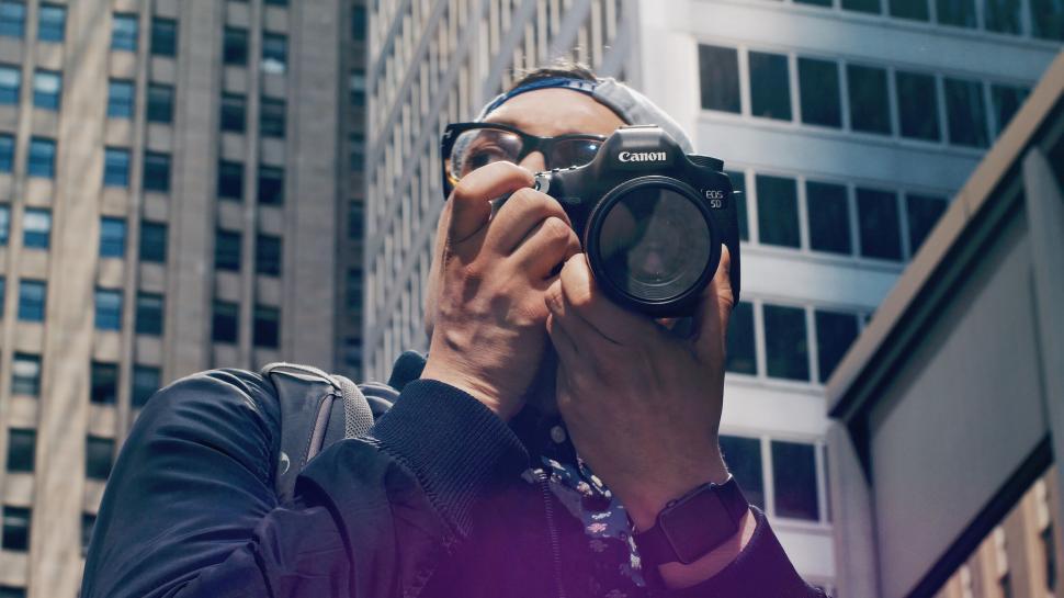 Free Stock Photo of Photographer with camera covering his face ...