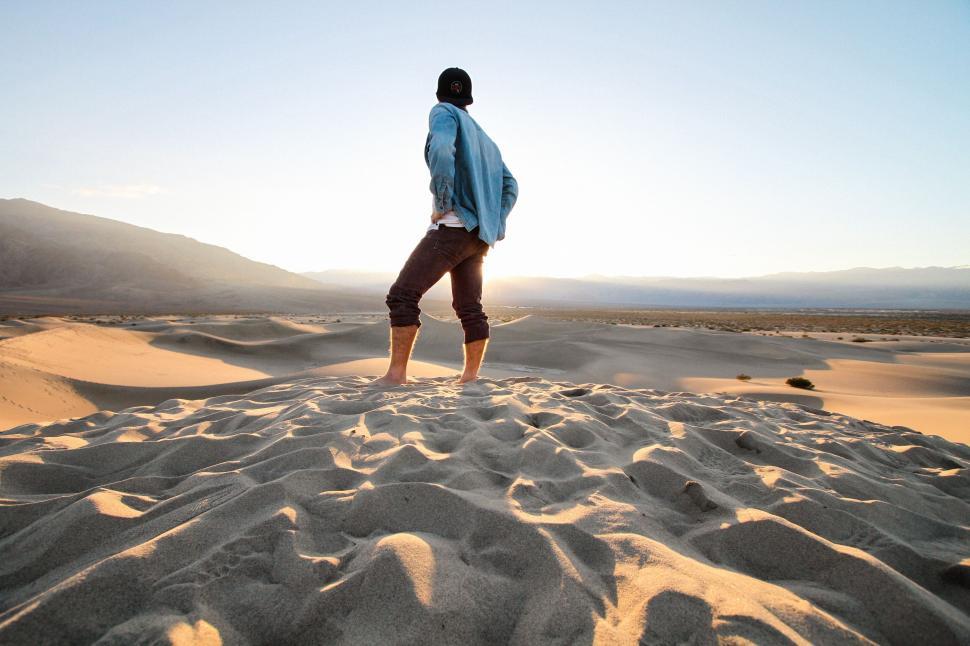 Free Stock Photo of Man standing on sand dunes at sunrise | Download ...