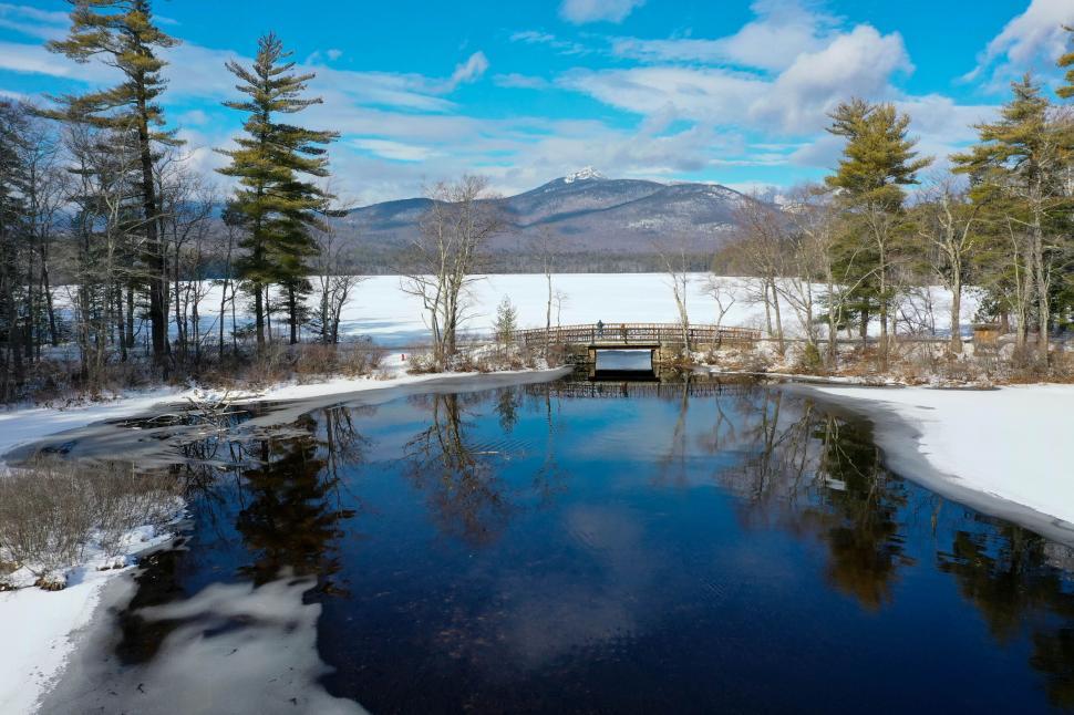 Free Stock Photo of Calm lake with snowy landscape and bridge ...
