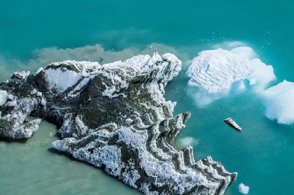 Free Stock Photo of Aerial shot of a boat navigating icy waters ...